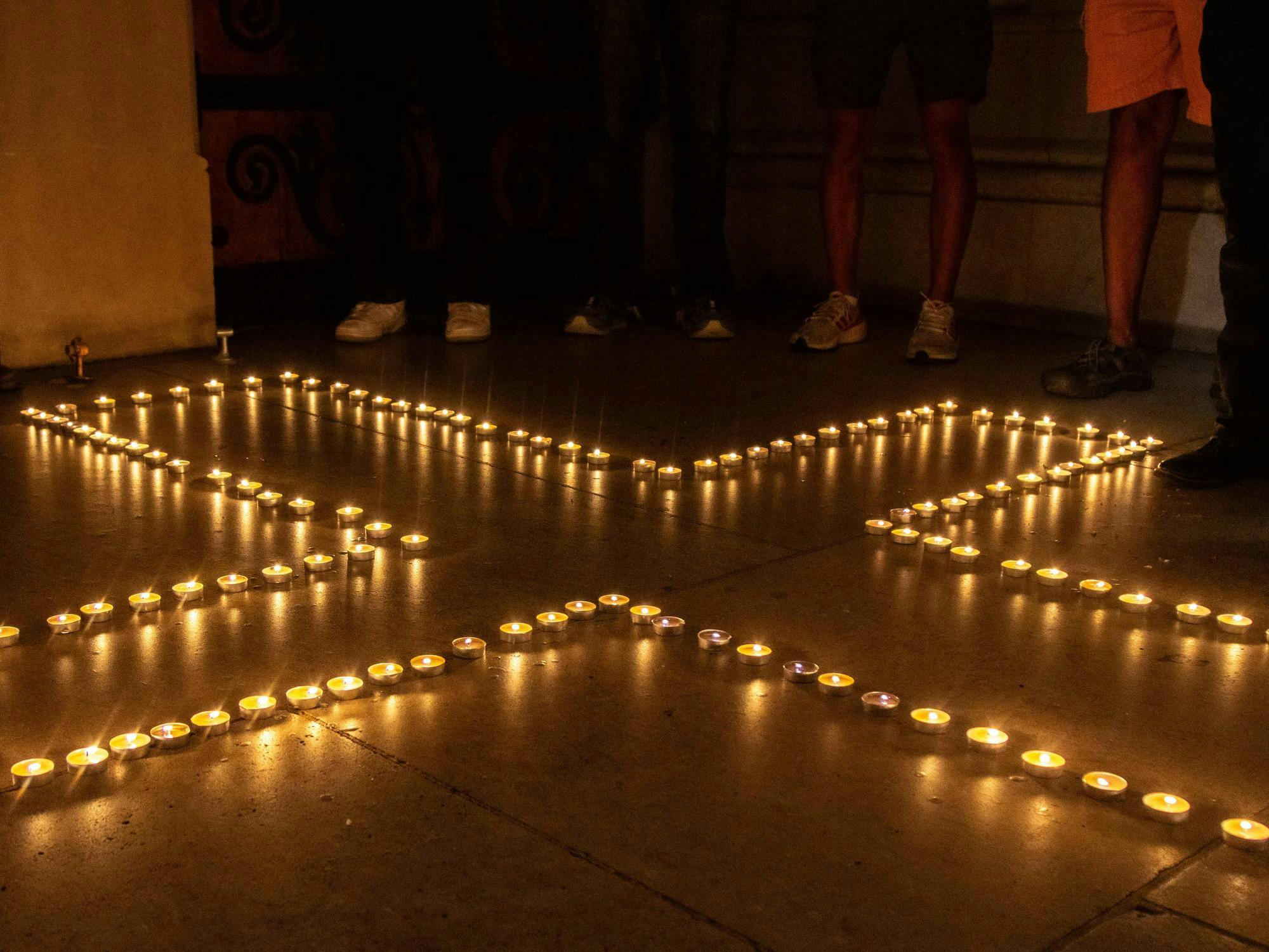 Duke community members hold vigil after killing of conservative ...