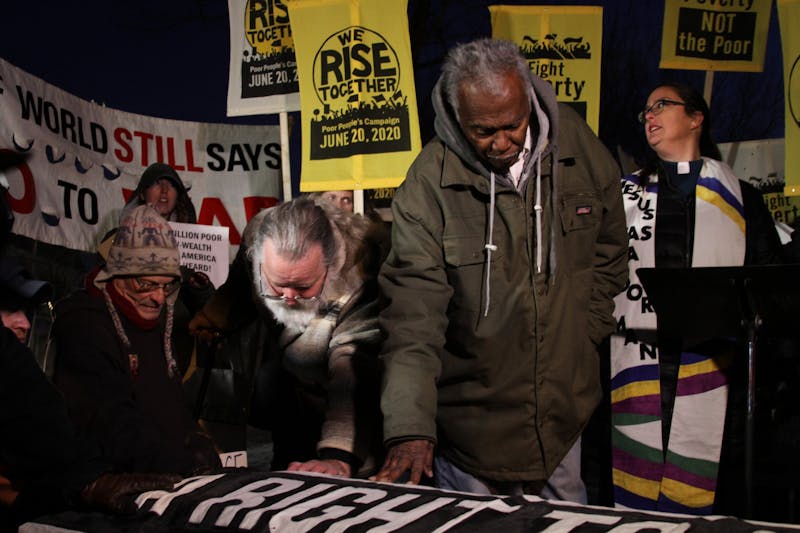 Protesters take to the streets of Drake University before Democratic ...