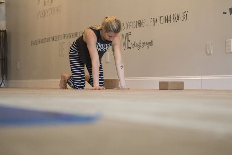 Feel Better Burlington offers free yoga to first responders - Elon News ...