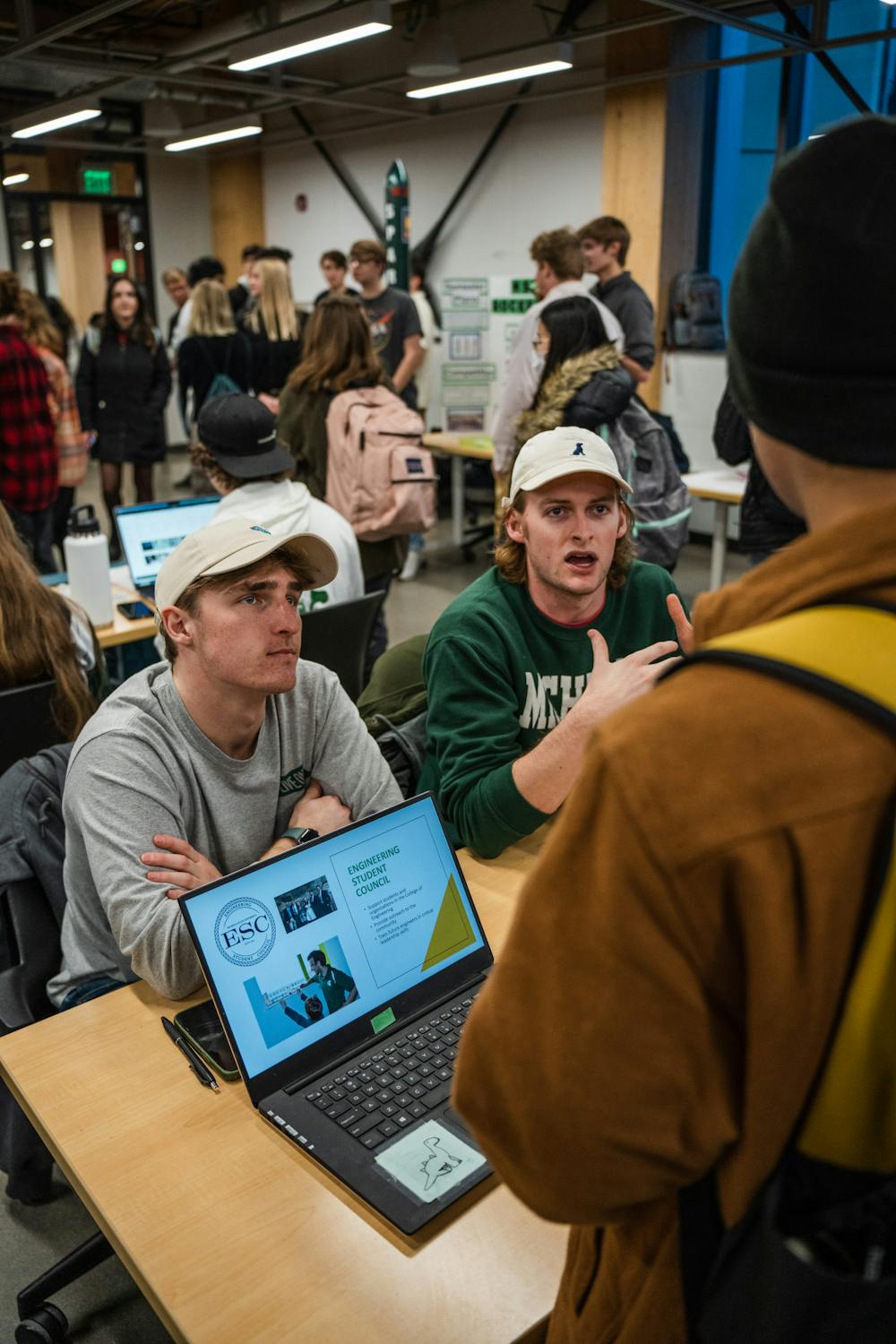 Two members of the Engineering Student Council answer questions at ...