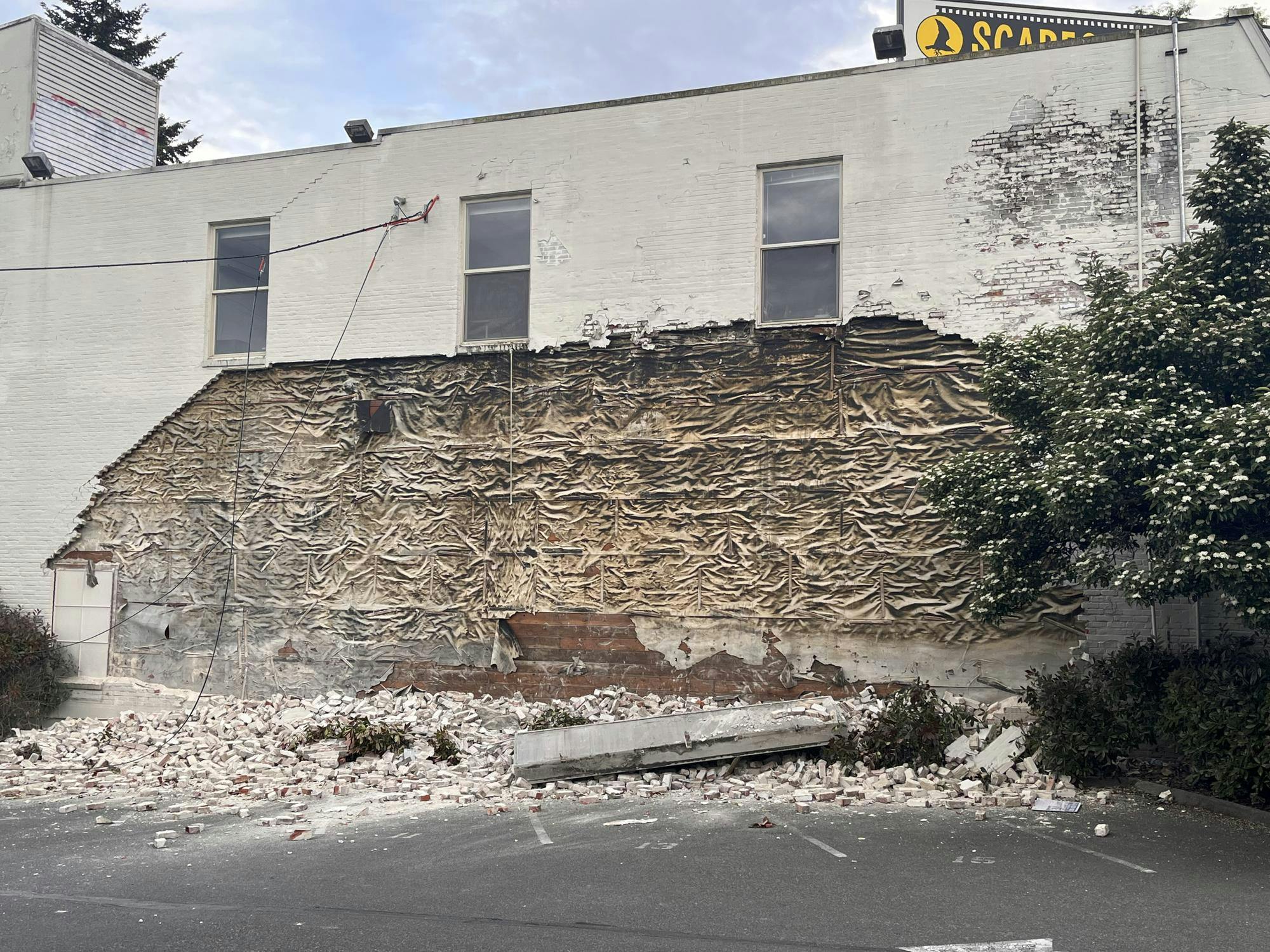 Scarecrow Video averts damage after brick facade collapse - The Daily